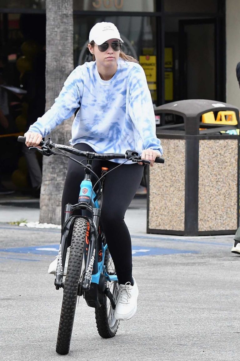 Christina Schwarzenegger in a White Cap Enjoys a Bike Ride with Her ...
