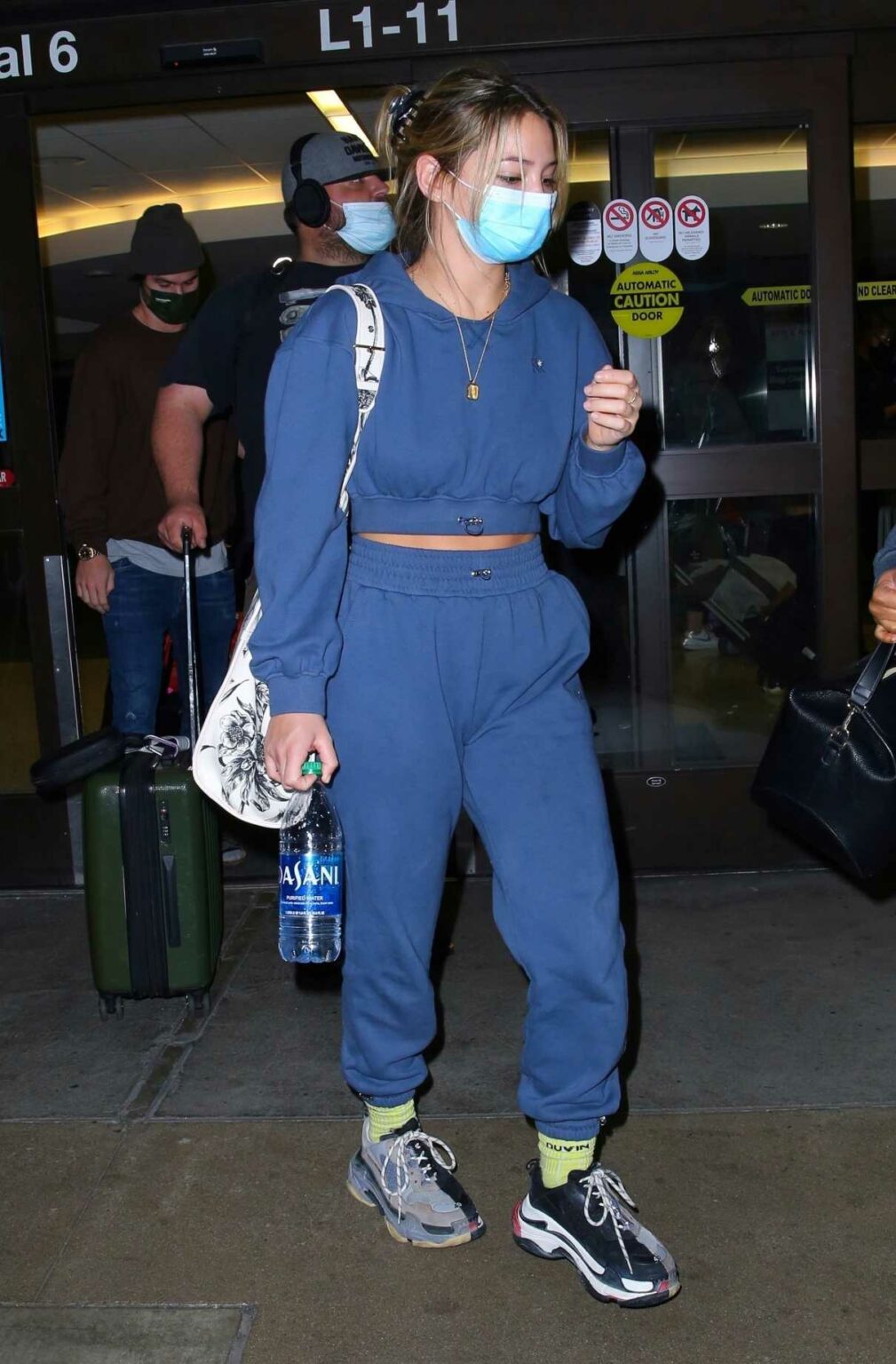 Madelyn Cline in a Blue Sweatsuit Arrives at LAX Airport in LA 05/31 ...