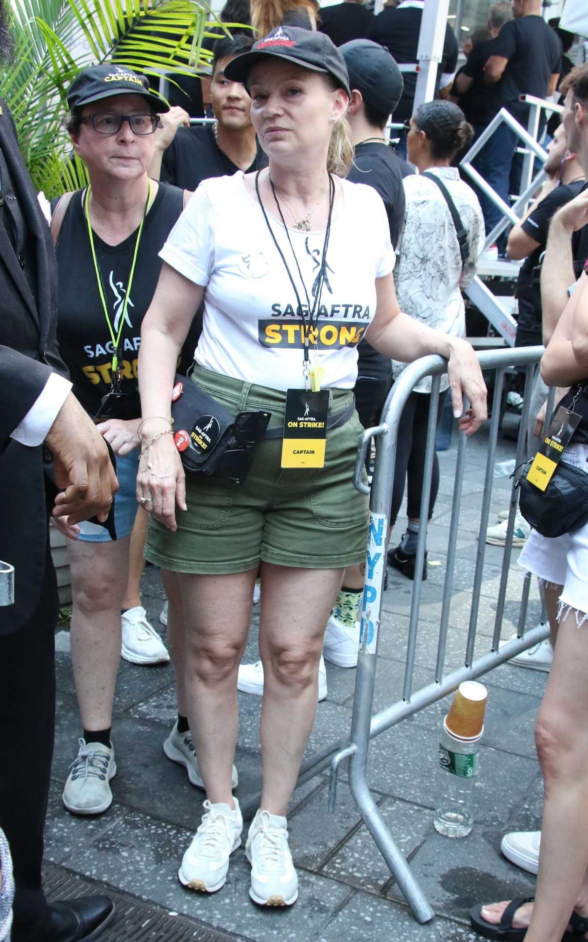 Samantha Mathis in a White Tee Attends the SAG-AFTRA and WGA Strike in ...