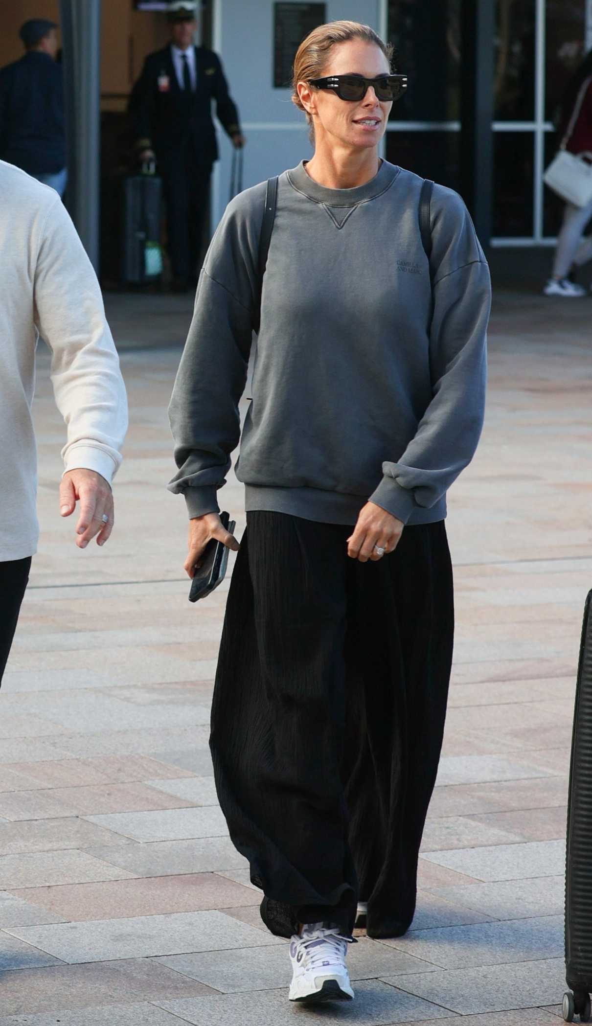 Candice Falzon in a Grey Sweatshirt Arrives at Sydney International ...